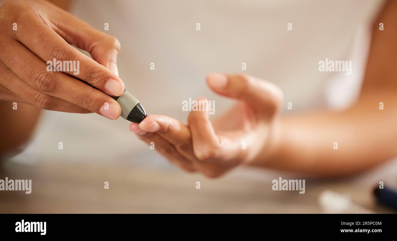 Finger, diabetes and a person checking their blood sugar level in a ...