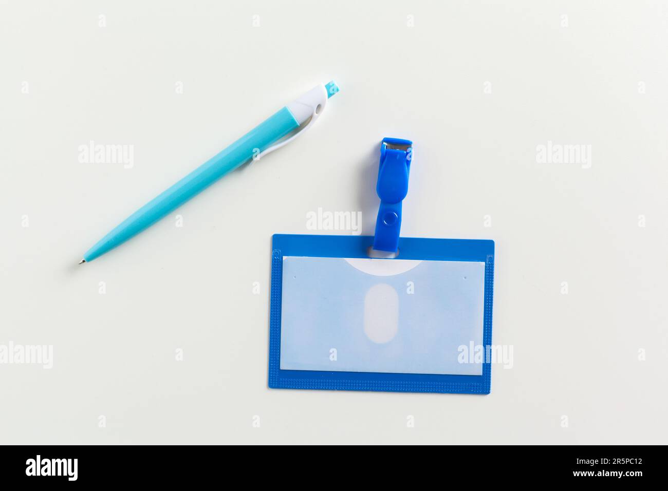 Name tag and a pen Stock Photo - Alamy