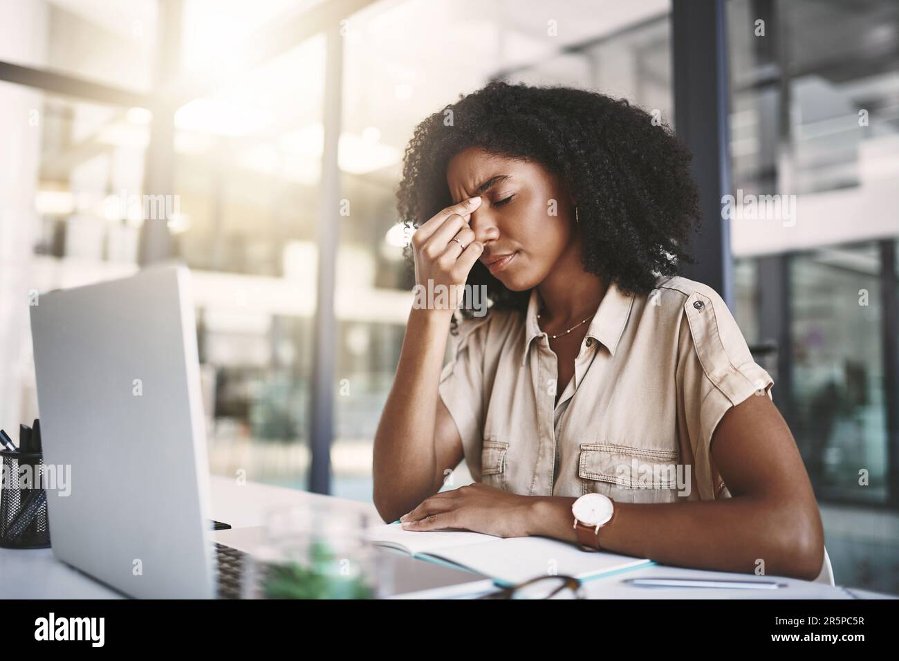 Why now. a young businesswoman looking stressed at her desk in a modern ...