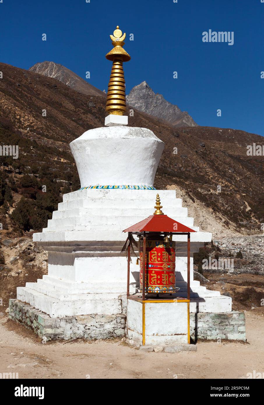 Buddhist stupa and prayer wheel in Thame village, Khumbu valley on ...