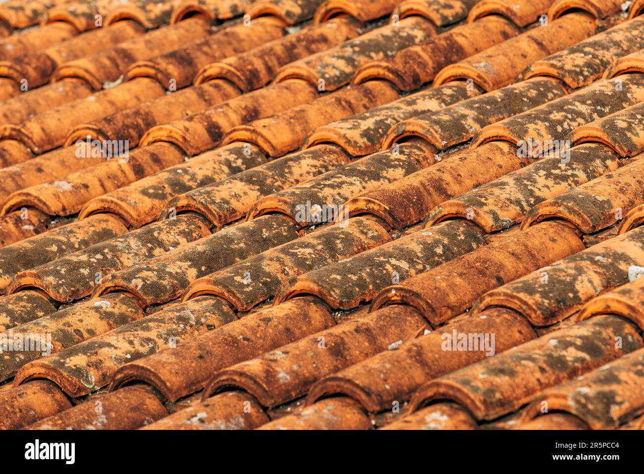 Old rustic terracotta roof tiles pattern as background, architectural ...