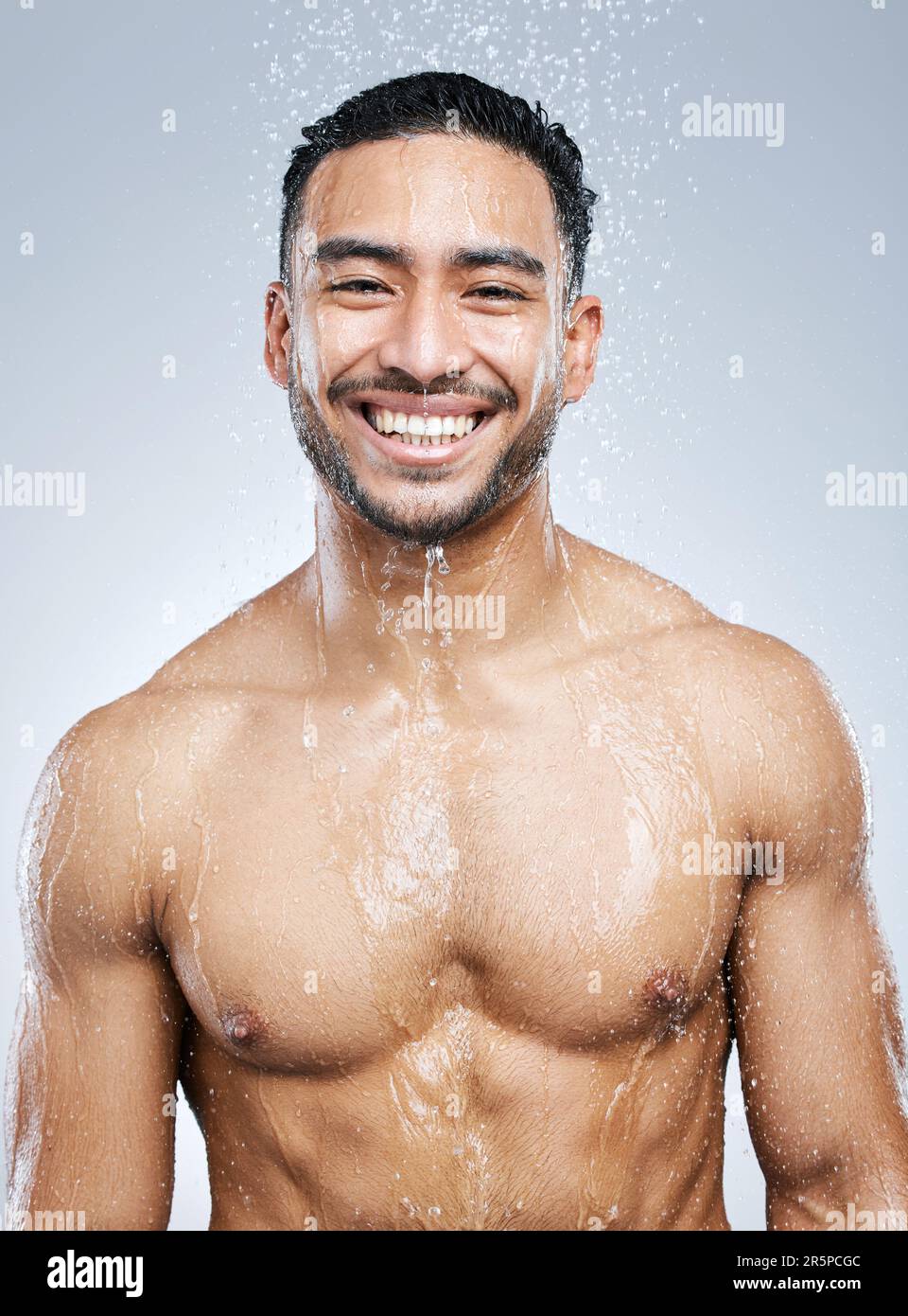 Portrait of man in shower with smile, cleaning and hygiene for healthy ...