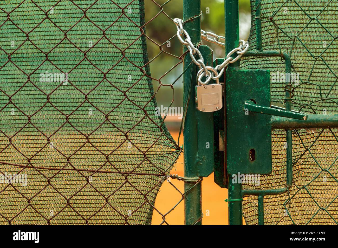 Locked gate with chain and padlock, selective focus Stock Photo - Alamy