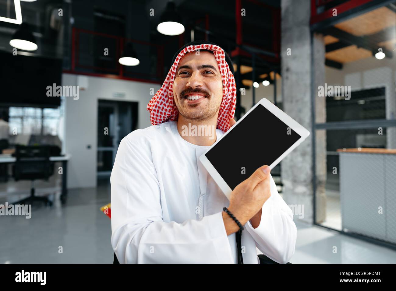 Arab muslim businessman using digital tablet in modern office Stock ...