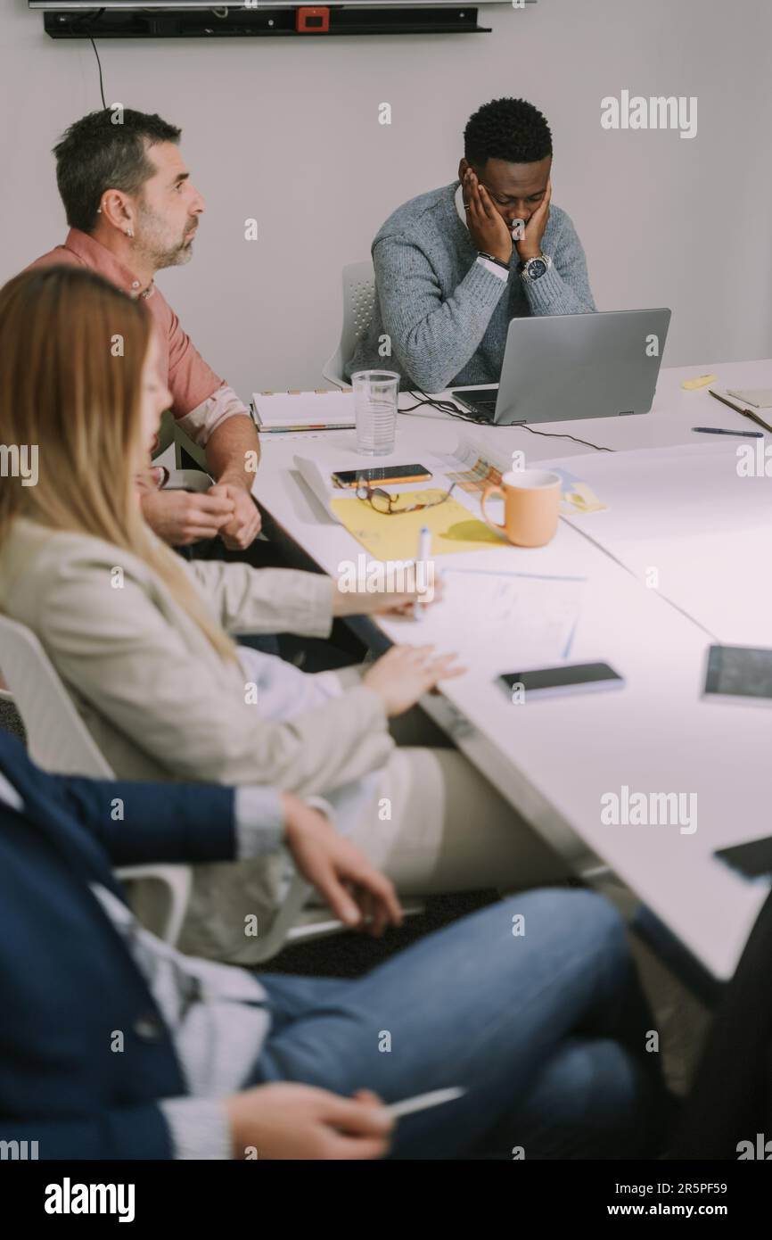 Diverse multi-generational group of people working on a new project ...