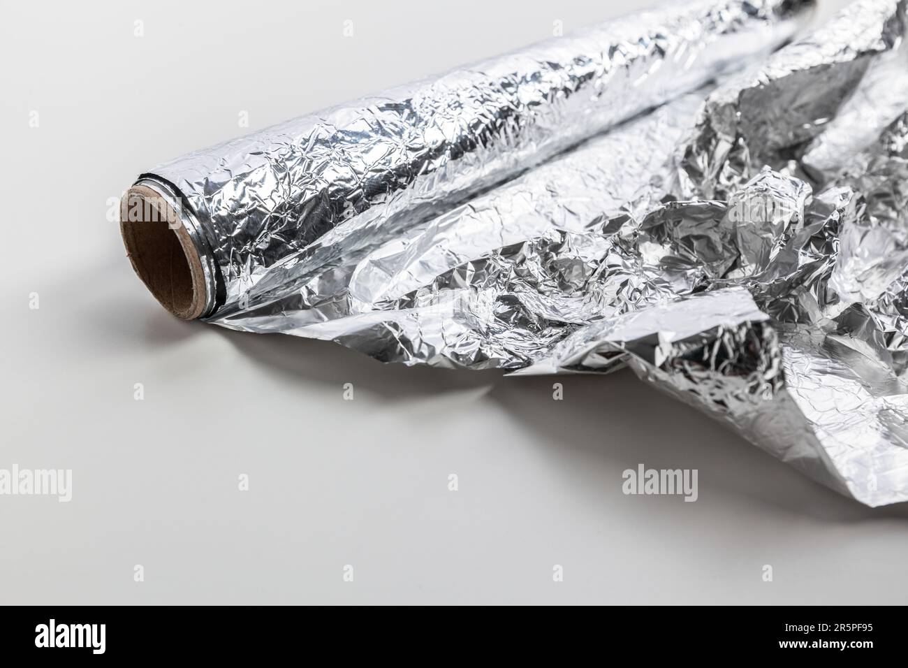 roll of aluminum foil isolated on white background Stock Photo - Alamy