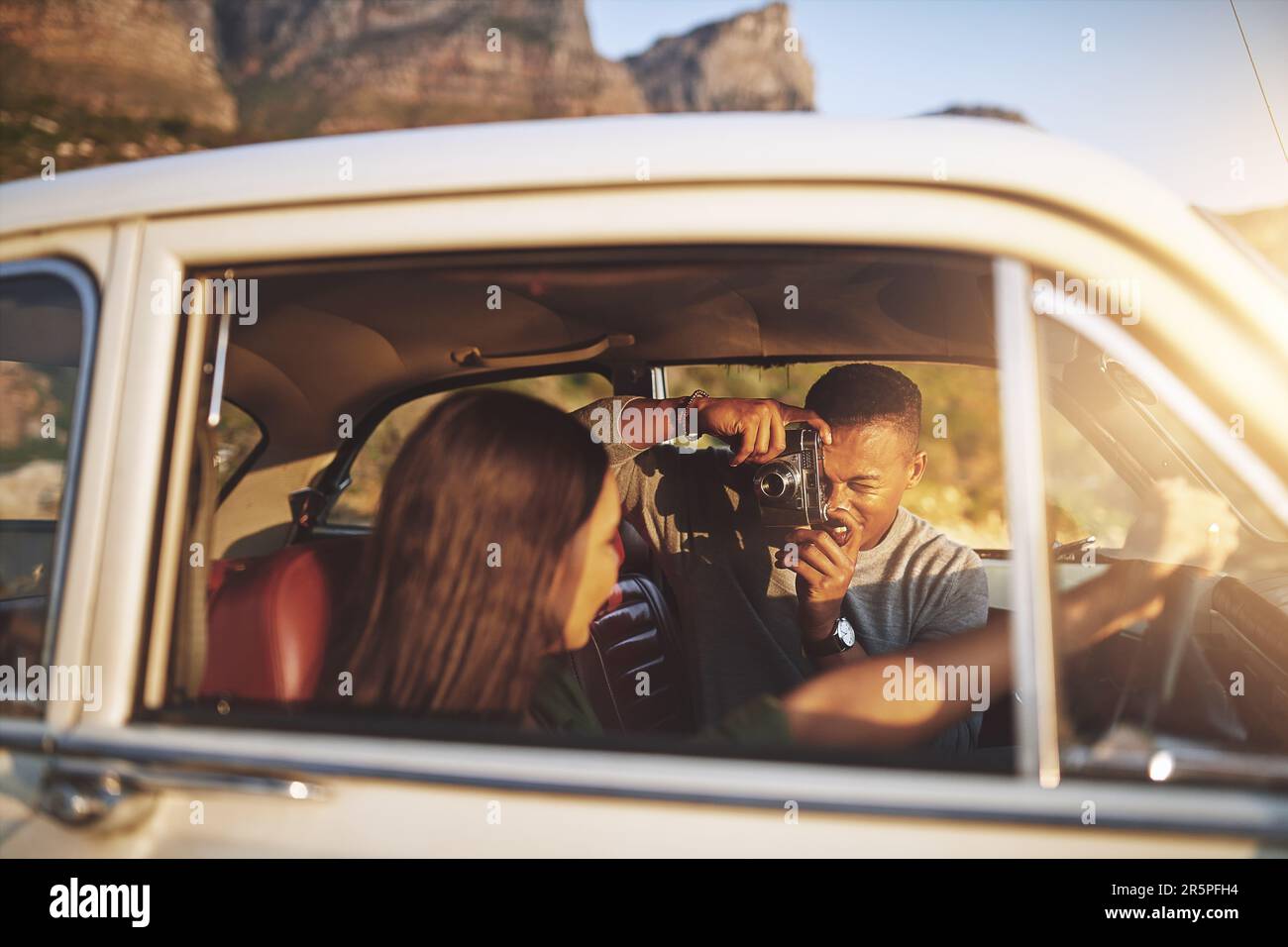 Let me capture your beauty. a young couple making a stop at the beach ...