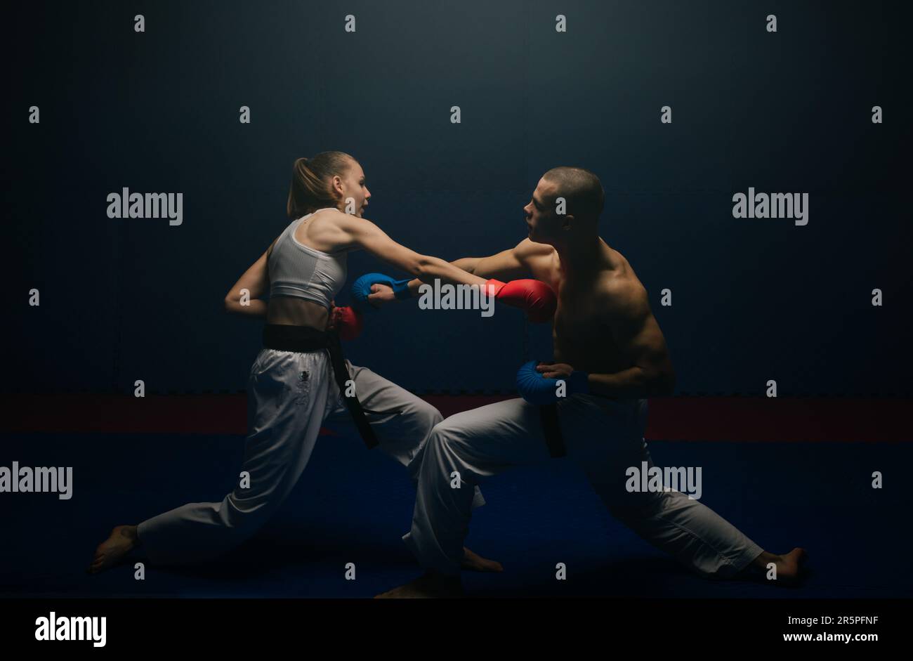 Good looking karate friends fight while doing karate pose at the karate ...