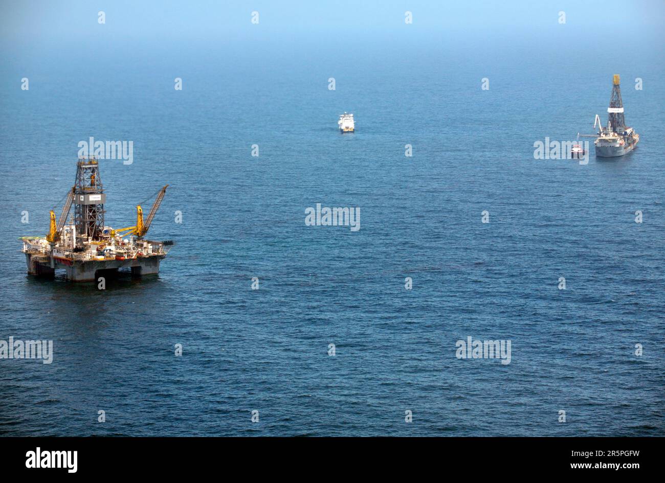 Aerial view of the Development Driller III, and other ships surrounded ...