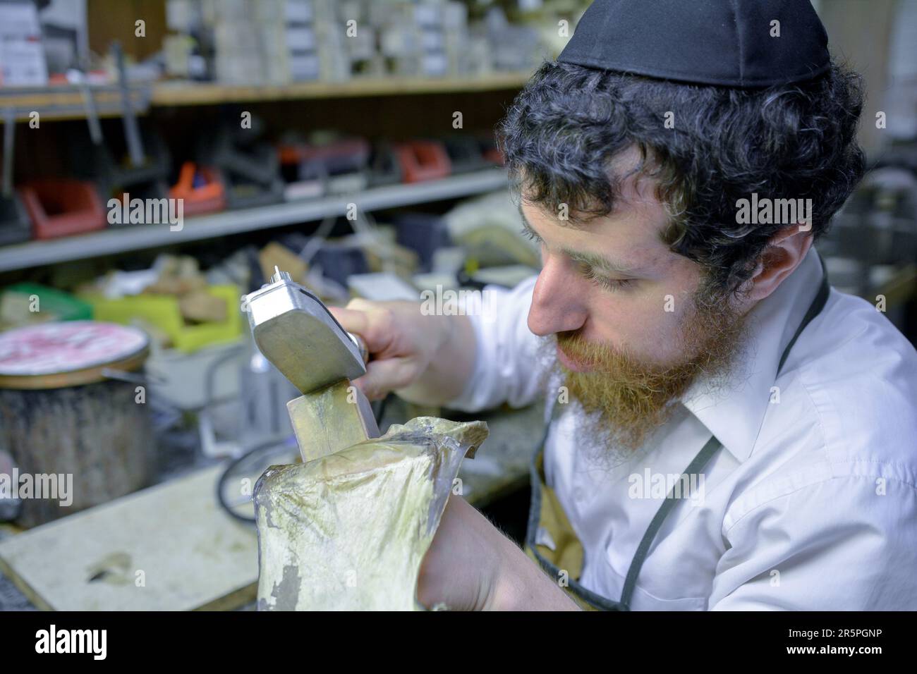 An orthodox Jewish master craftsman makes tefillin in his basement ...