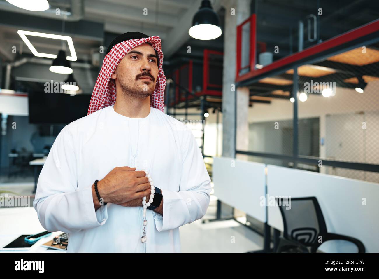 Successful muslim businessmen in traditional outfit in his office Stock ...