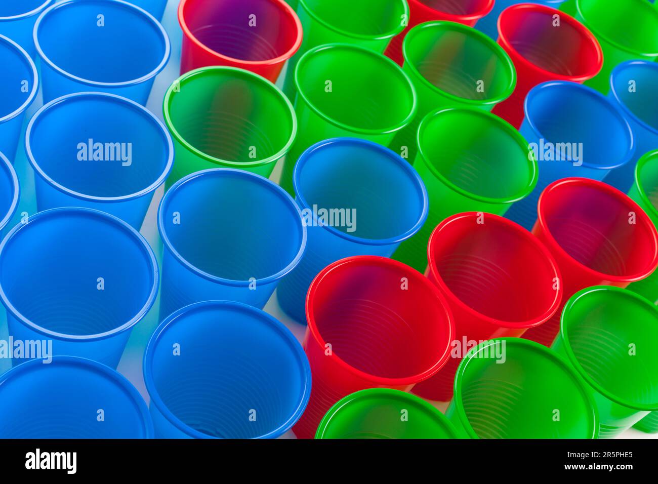 Multicolor plastic glasses isolated on white background Stock Photo - Alamy