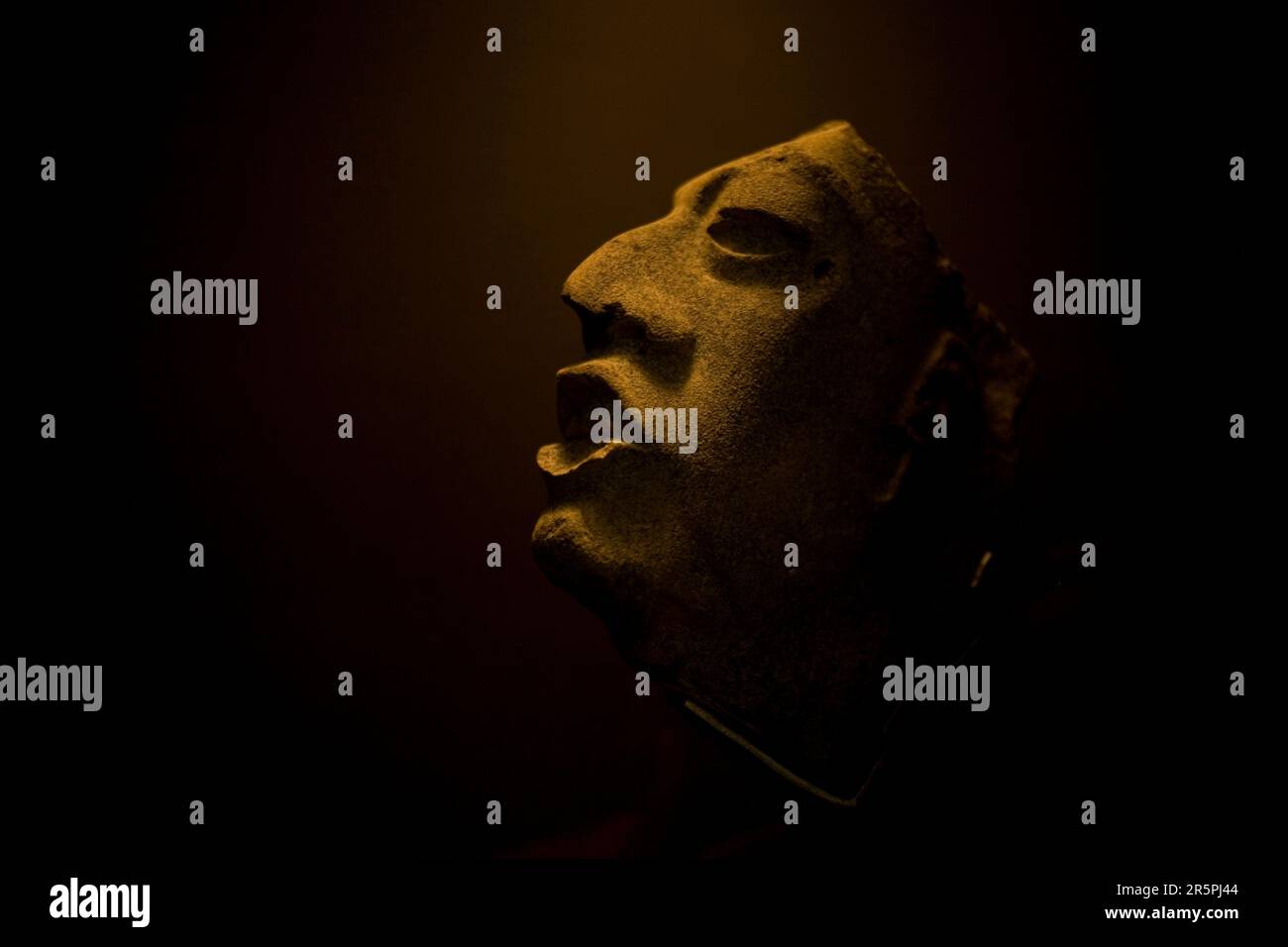 A human head sculpture sits on display in the museum at the ancient ...