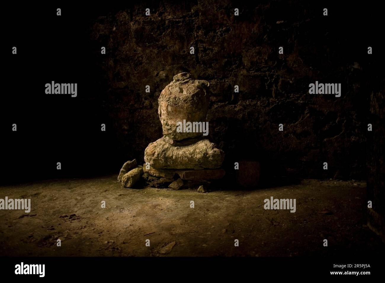 A Mayan God sculpture in lotus position is seen on a building at the ...