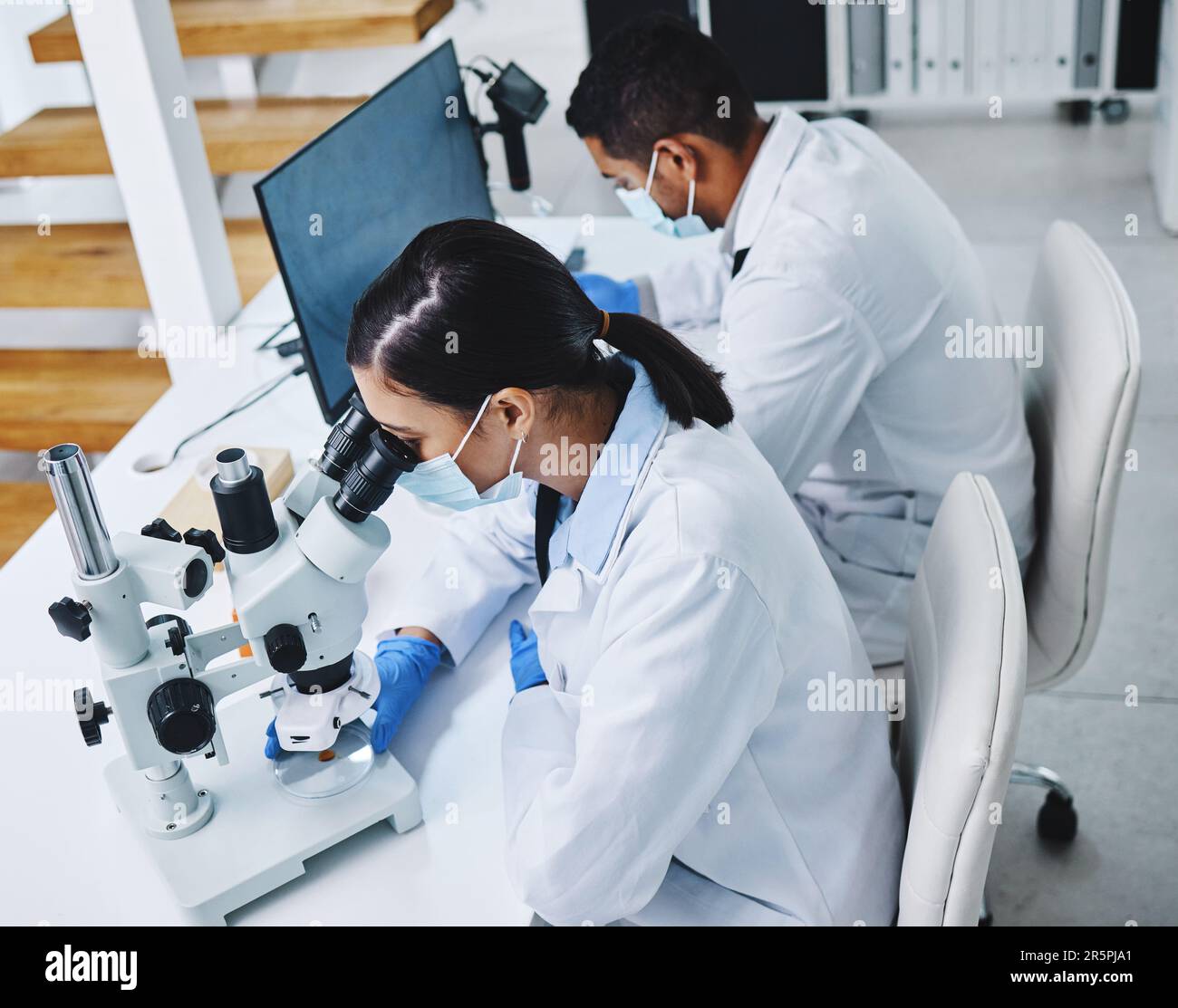 Science, laboratory and scientists with microscope and computer for ...