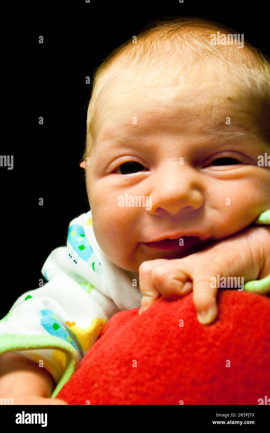 Newborn baby on parent's shoulder Stock Photo - Alamy