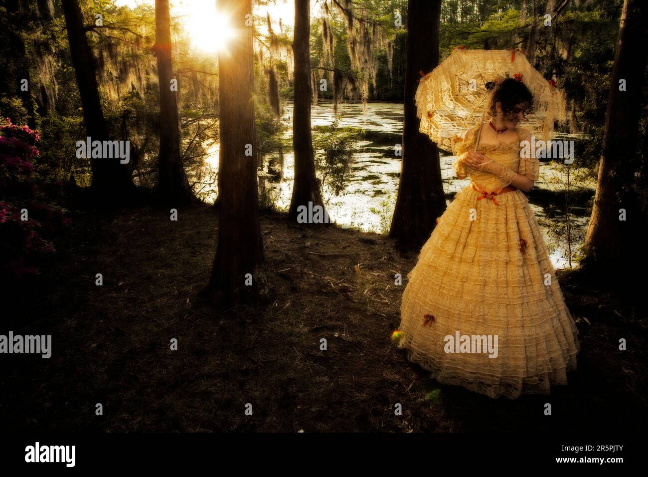 A young woman poses in a Southern Belle outfit , including a large ...