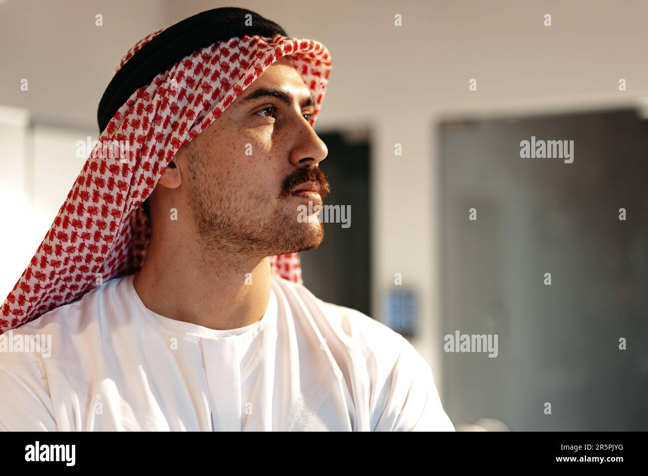 Successful muslim businessmen in traditional outfit in his office Stock ...