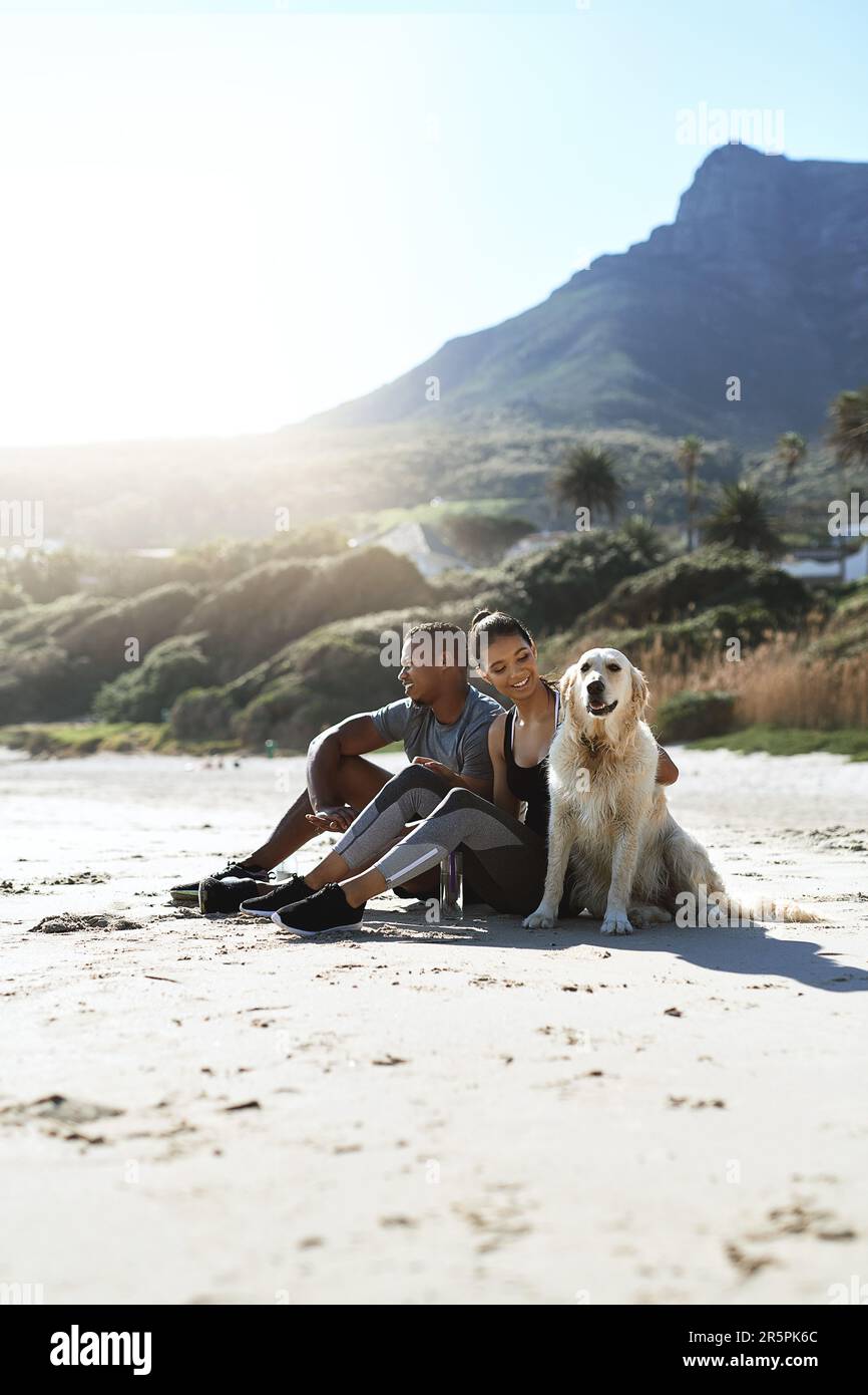They have a furry companion joining in their fitness journey. a sporty ...