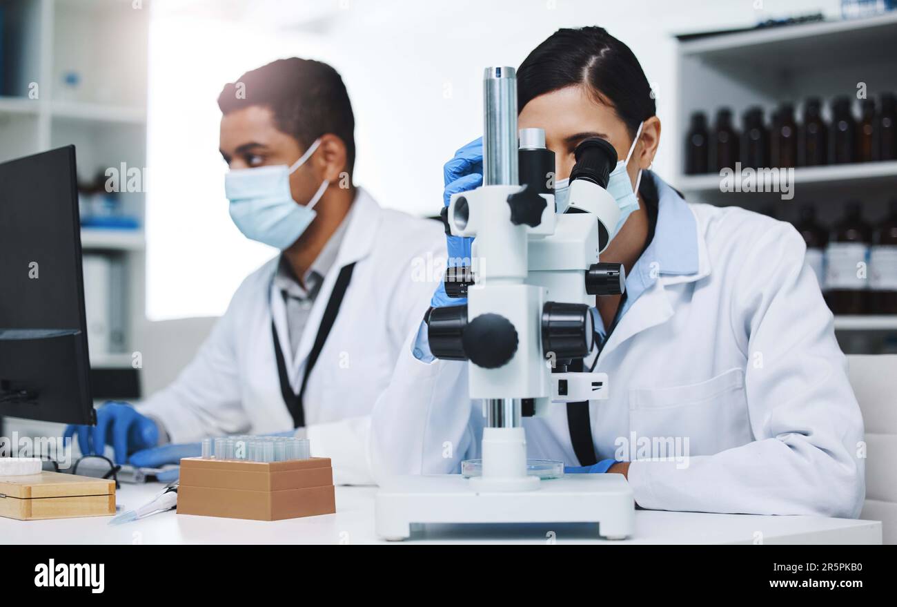 Science, laboratory and team of scientists with microscope for research ...
