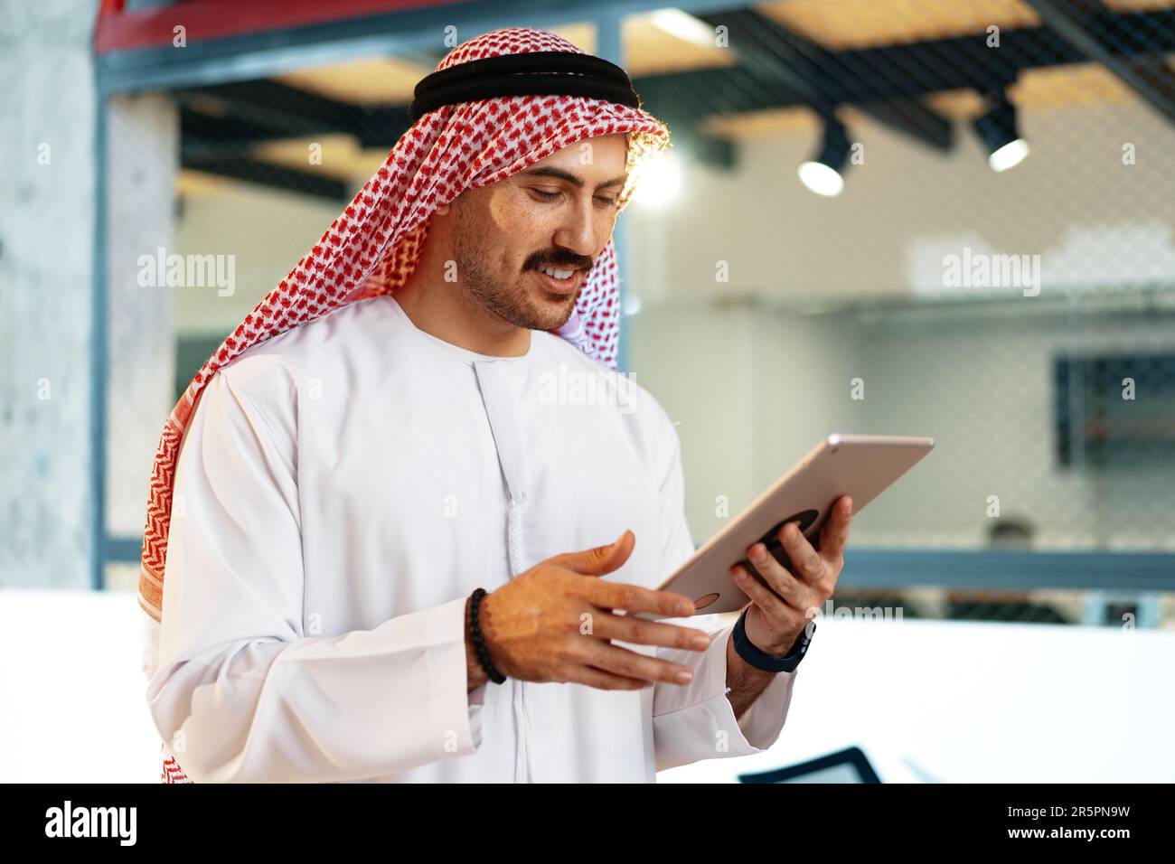 Arab muslim businessman using digital tablet in modern office Stock ...