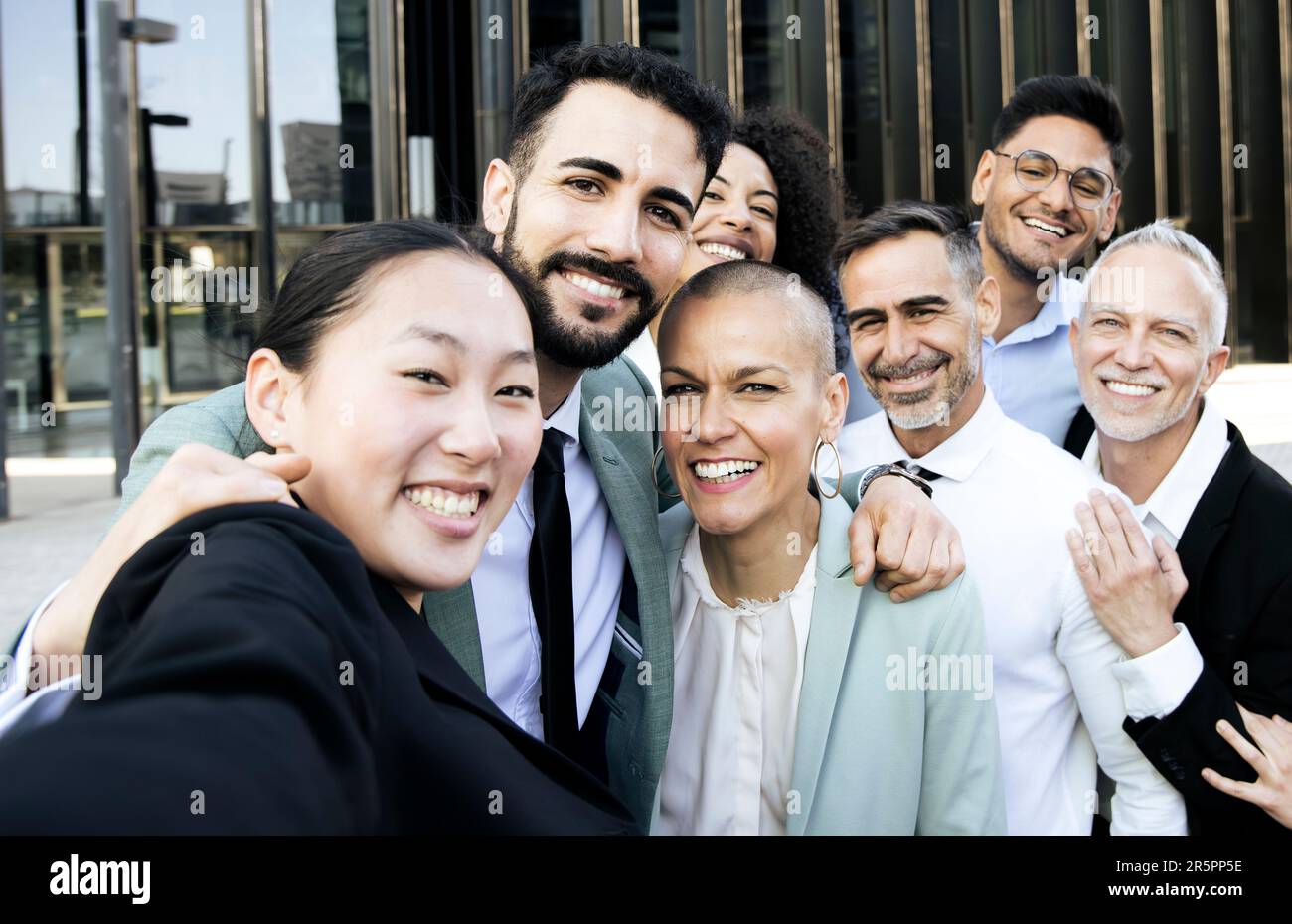 Multiracial group of cheerful and successful business people taking a ...
