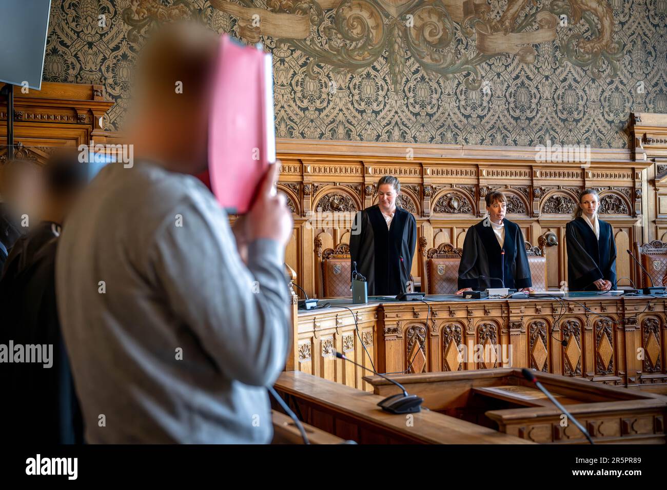Bremen, Germany. 05th June, 2023. The defendants stand before Judge ...