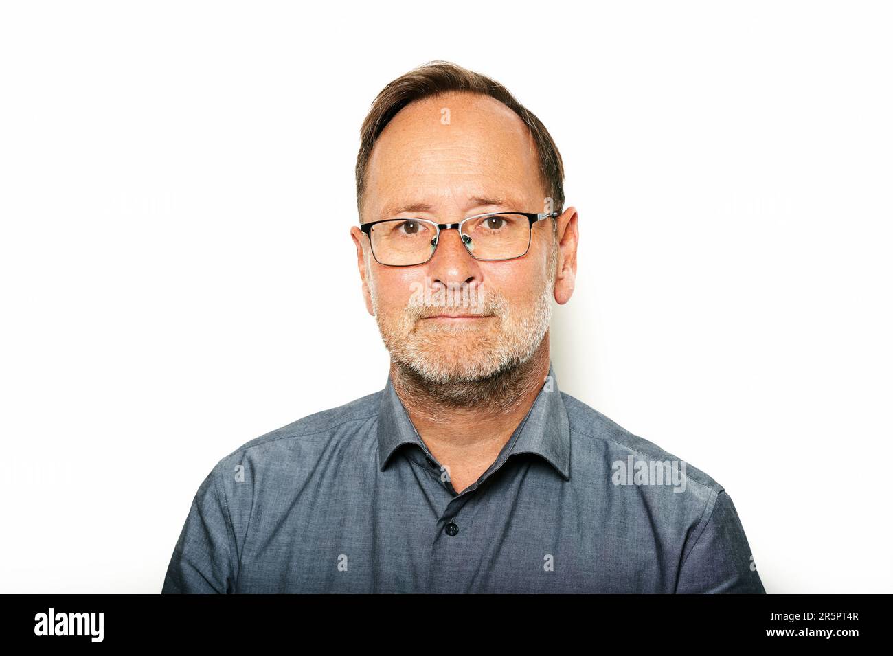 Close up portrait of middle age man taken on white background, wearing ...