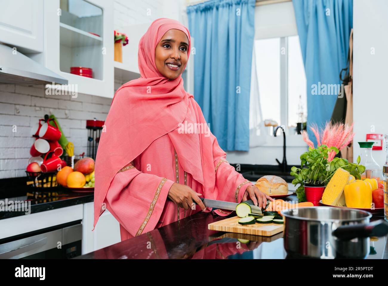 Happy middle-eastern woman wearing abaya at home - Beautiful muslim ...