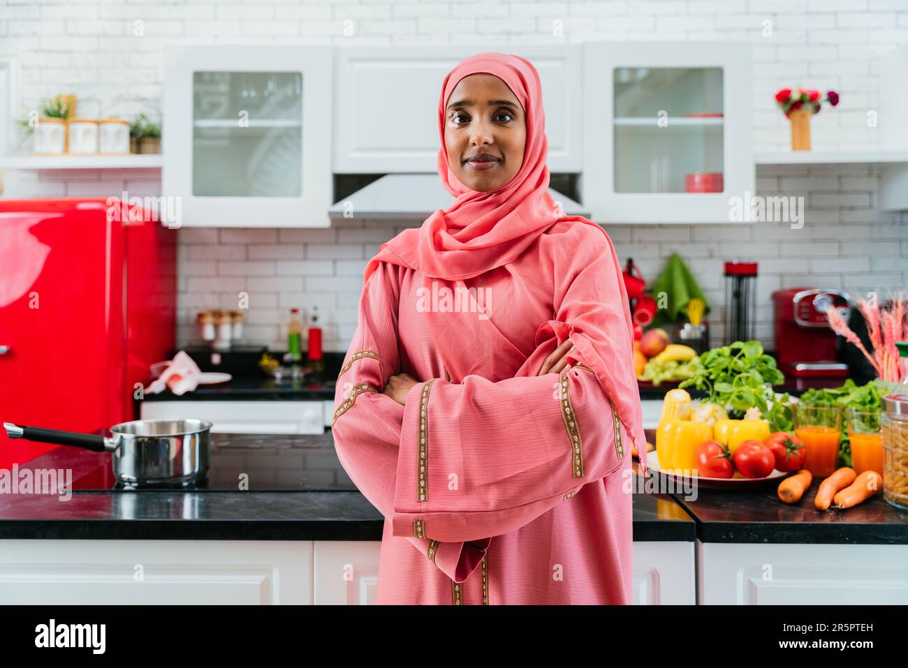 Happy middle-eastern woman wearing abaya at home - Beautiful muslim ...