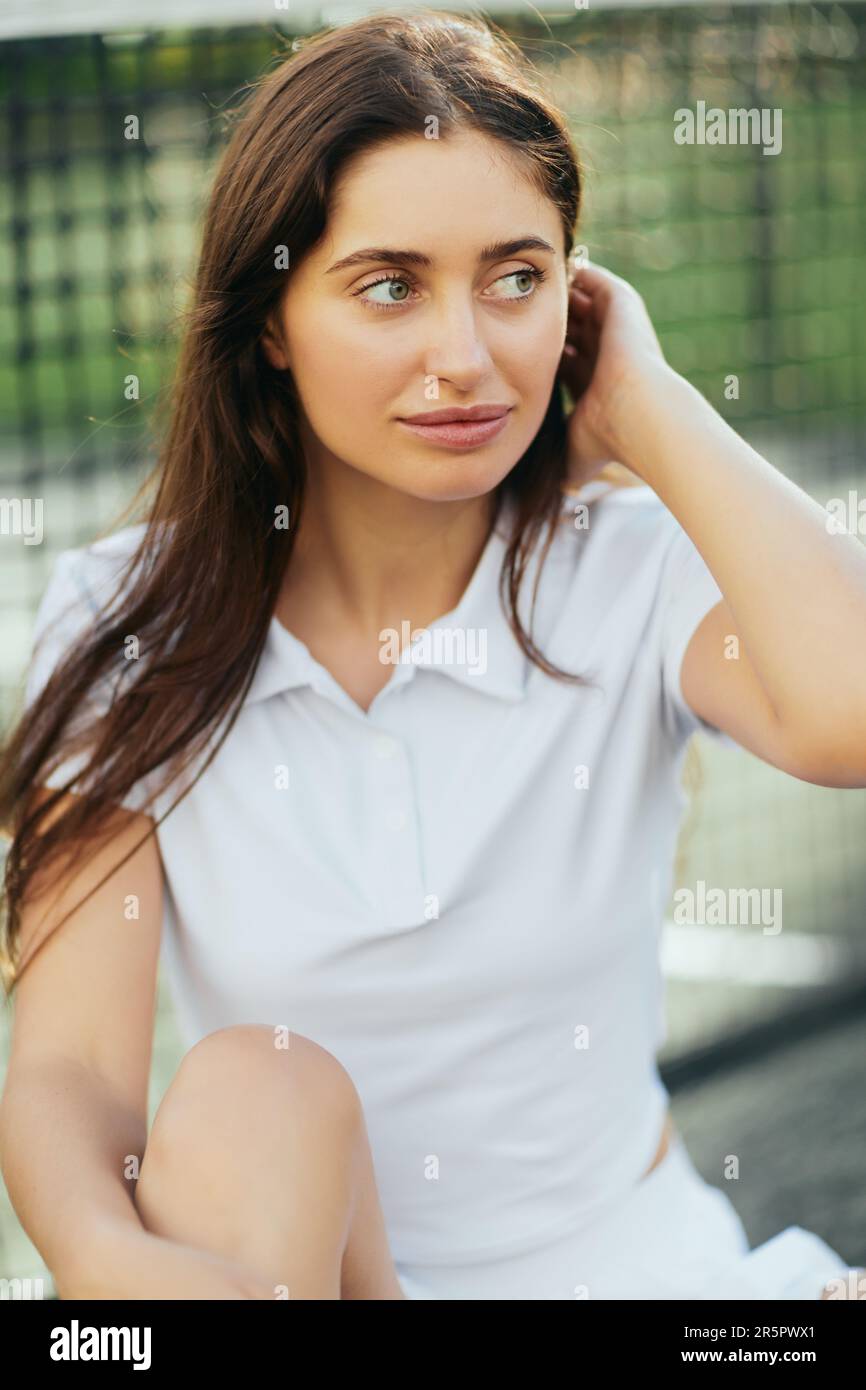 Woman wearing white polo shirt hi-res stock photography and images - Alamy