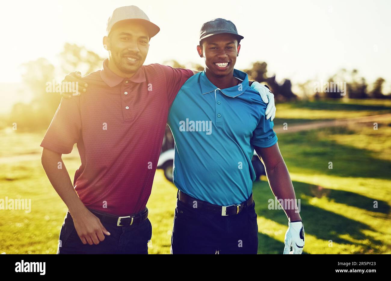 I prefer golfing with a buddy. two friends standing together on a golf course Stock Photo - Alamy