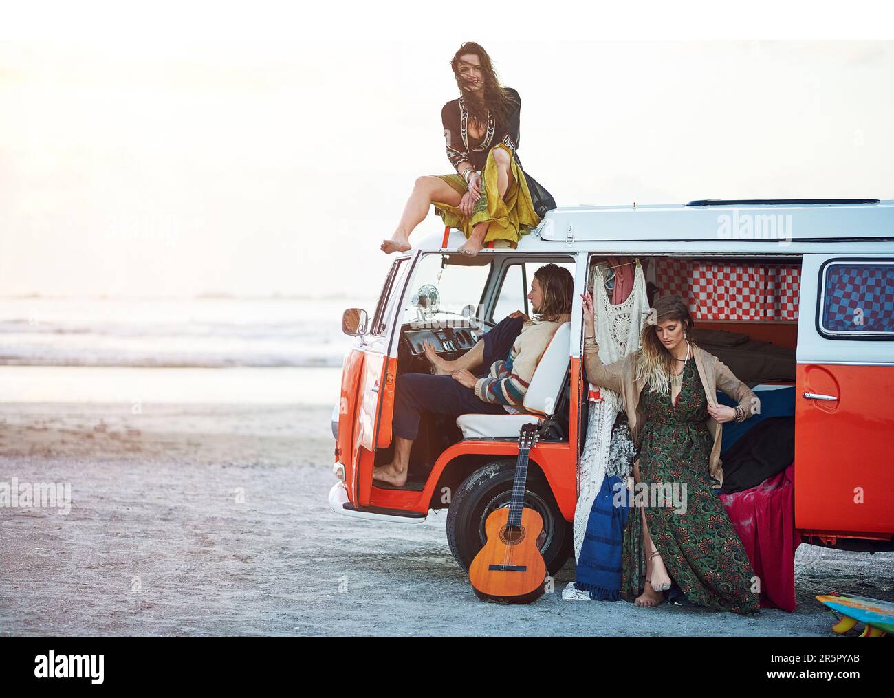 Enjoy the journey. a group of young friends stopping at the beach ...