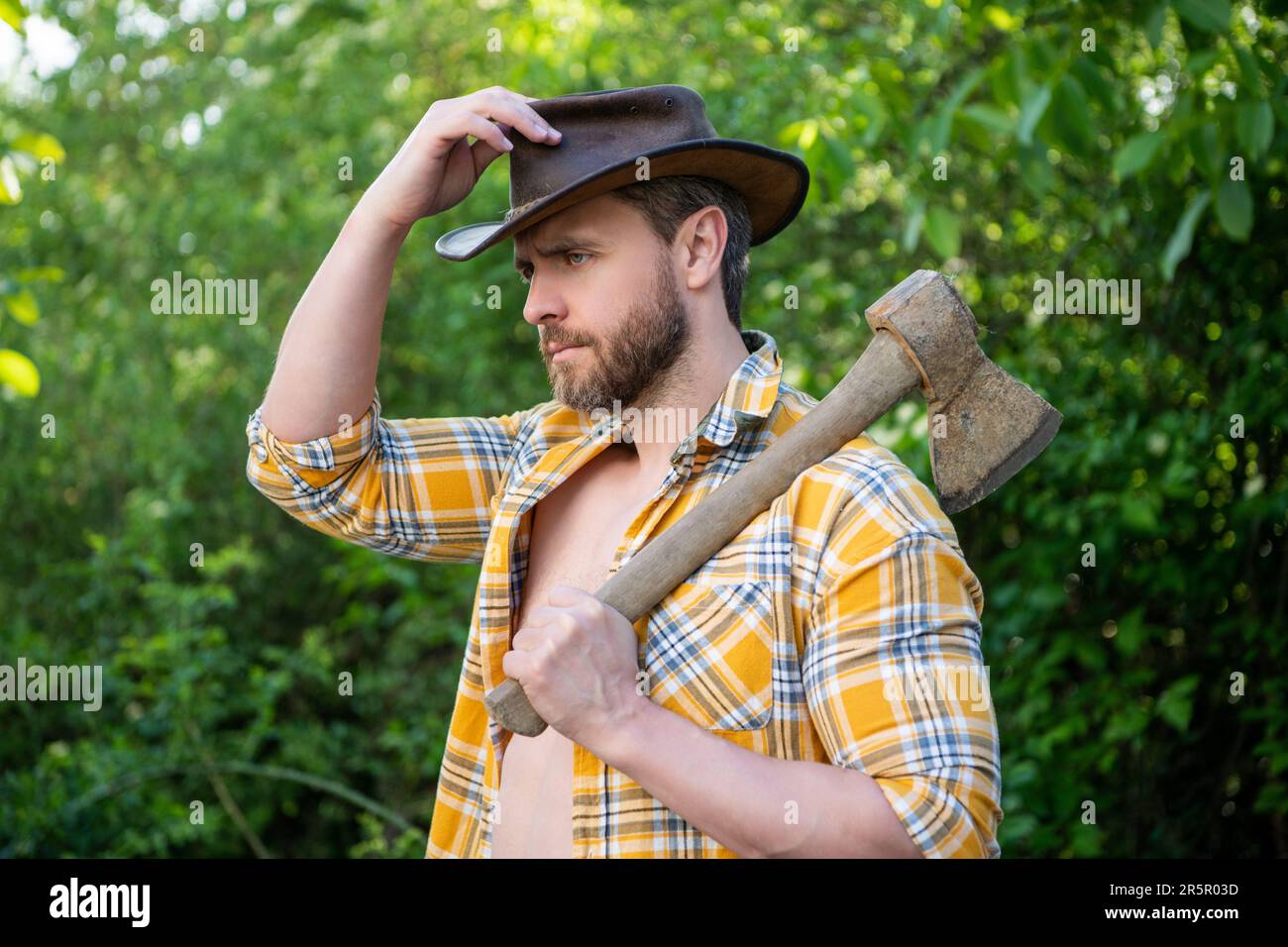 cowboy with axe outdoor. photo of cowboy with axe. cowboy with axe ...
