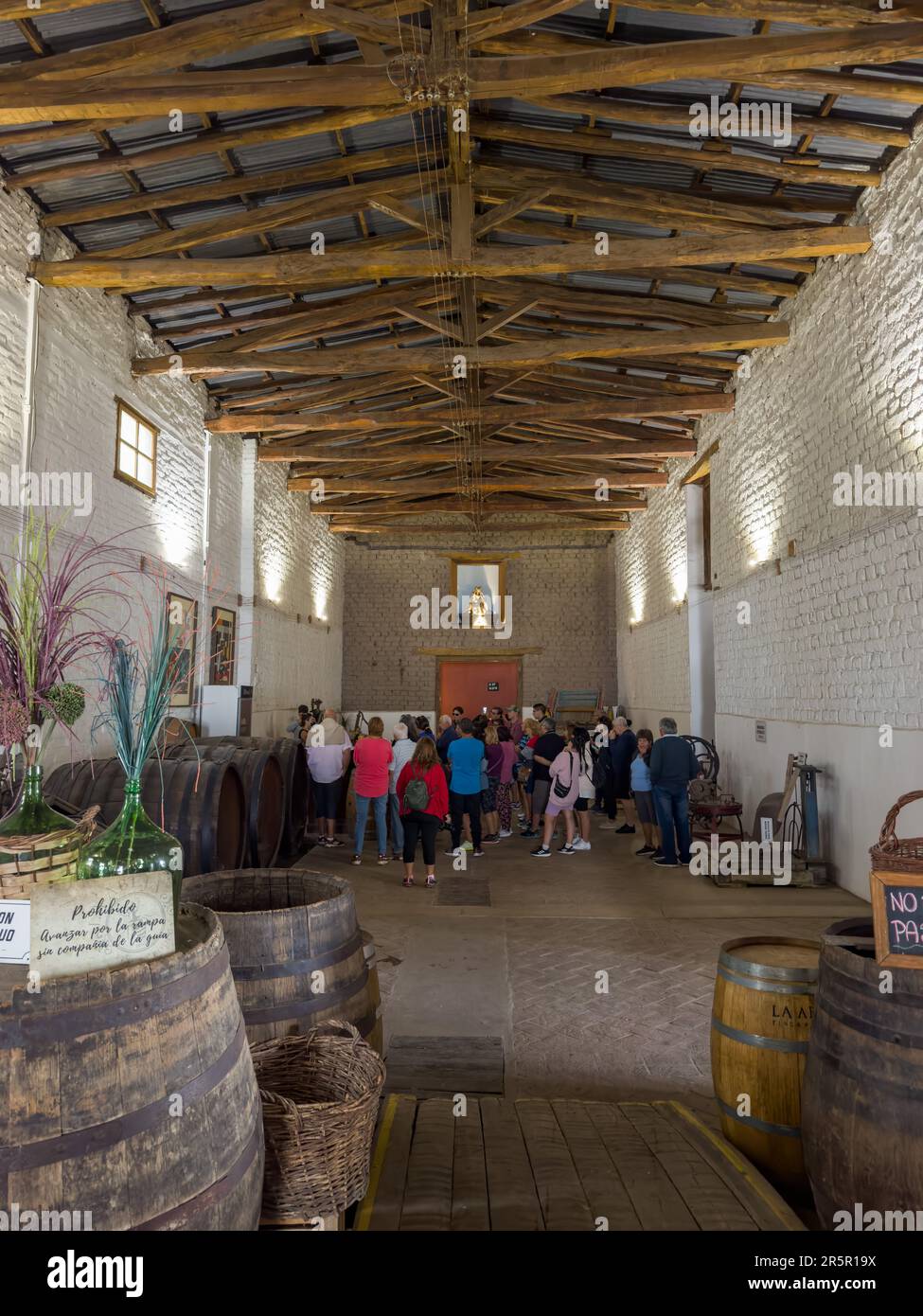 Visitors tour the museum at La Abeja Winery, San Rafael, Argentina. La ...