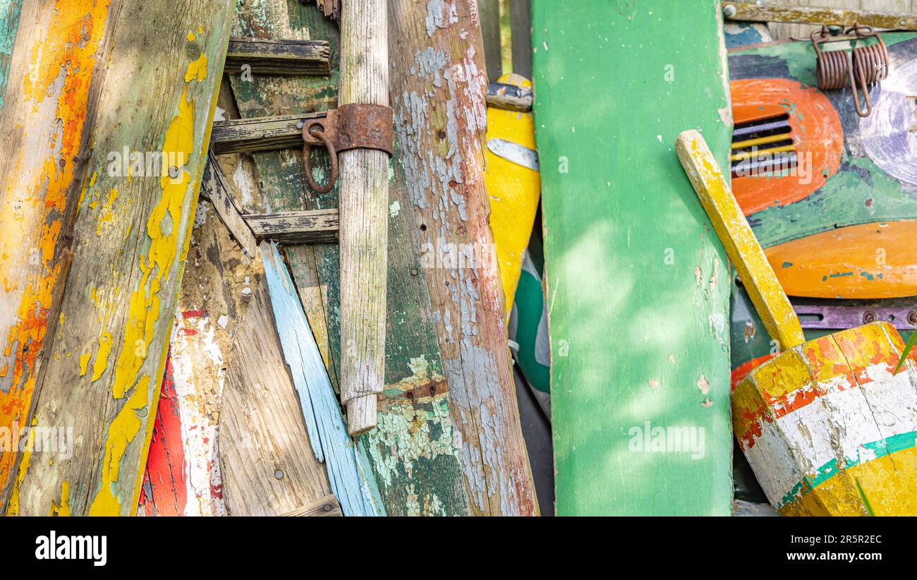 random colorful old wooden objects stacked up Stock Photo - Alamy