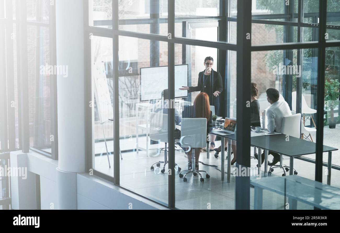Achieving success begins in the boardroom. an executive giving a ...