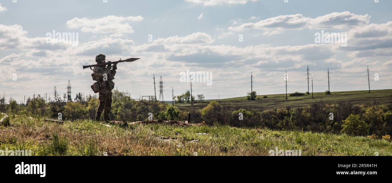 A Ukrainian Armed Forces soldier with a grenade launcher at a firing ...