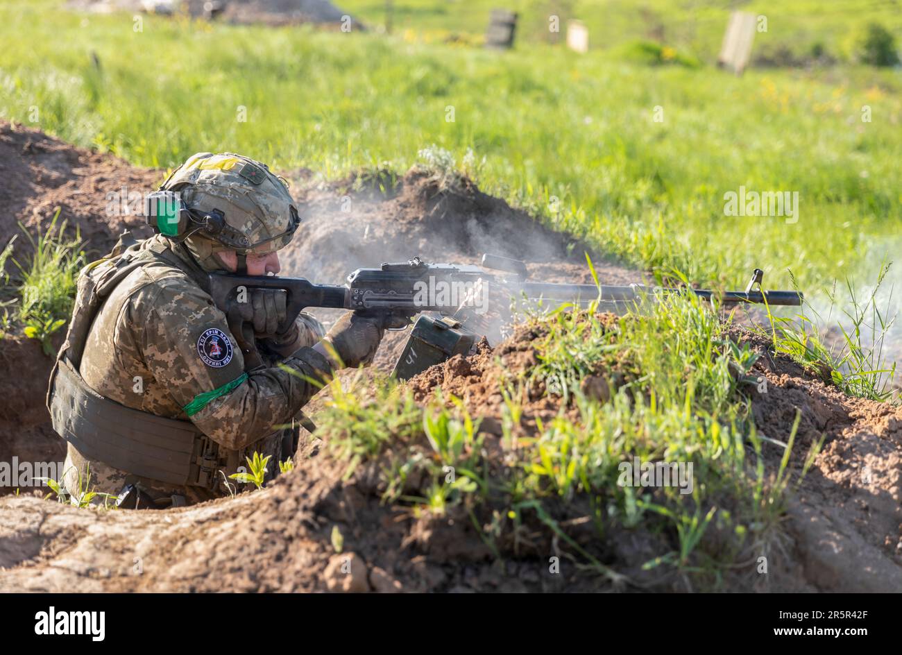 A Ukrainian Armed Forces soldier fires an automatic weapon during ...
