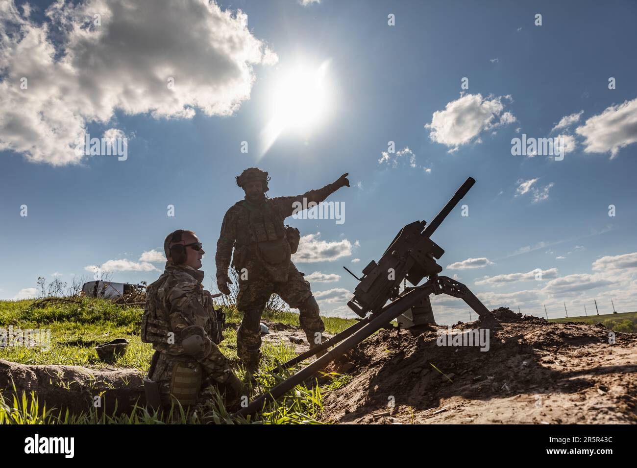 Ukrainian Armed Forces soldiers at a firing position prepare to fire ...