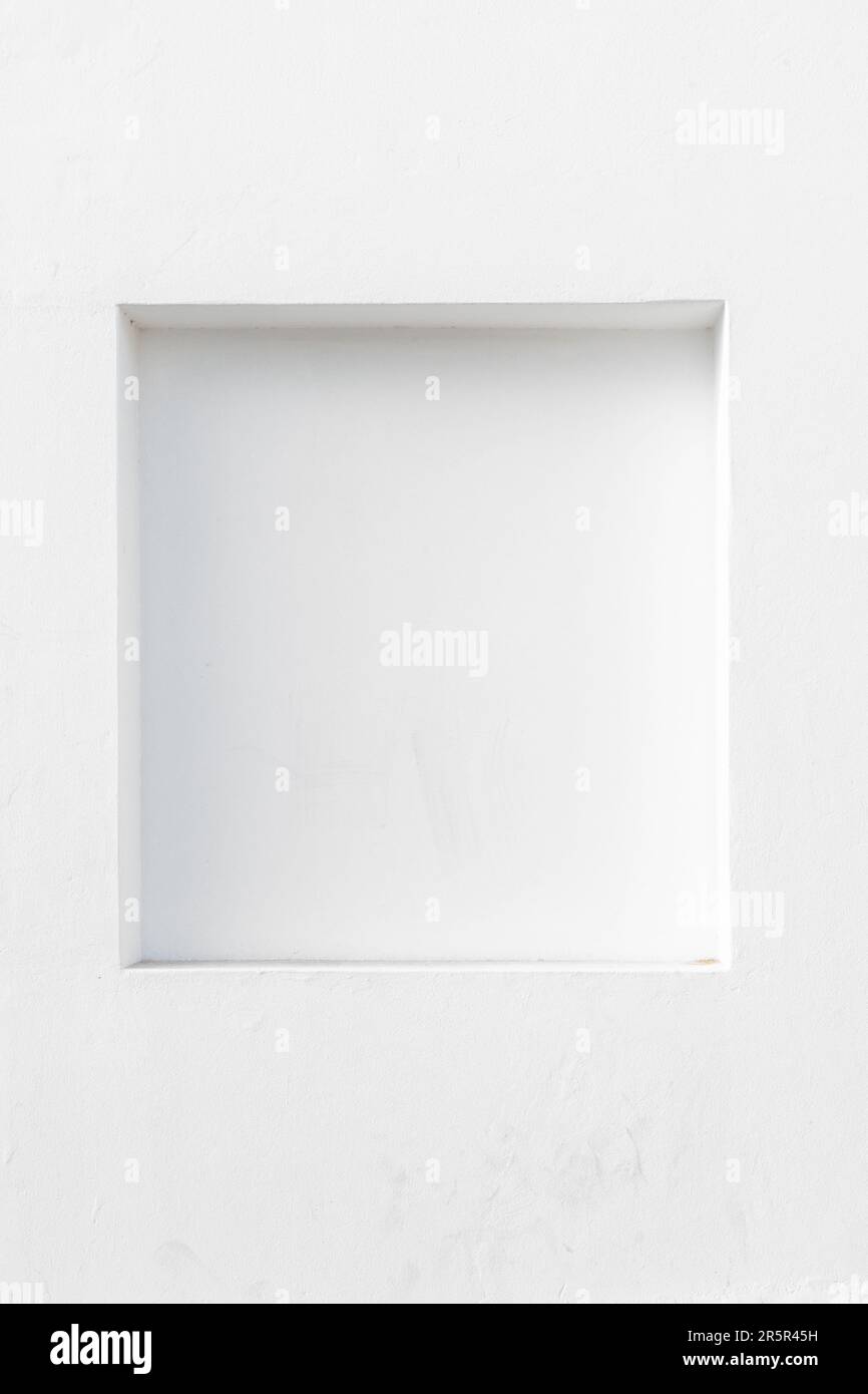 background of white wall with indentation in plastered wall forming a ...