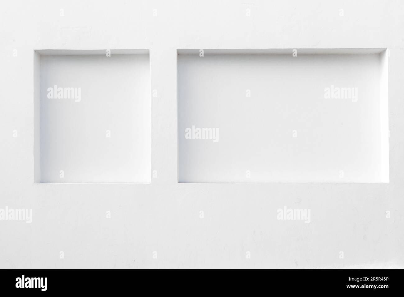 background of white wall with indentation in plastered wall forming a ...