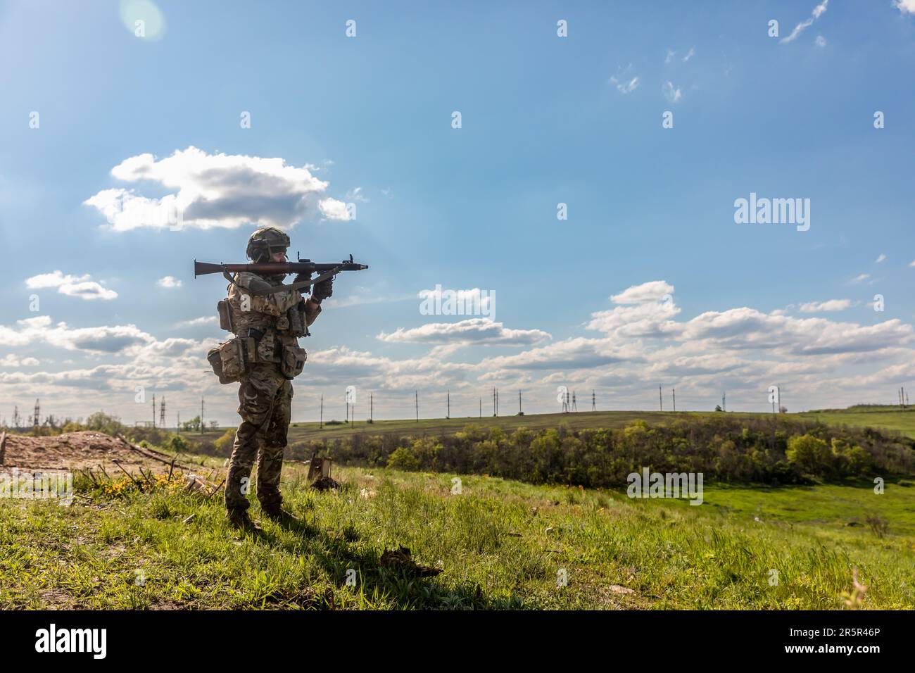 A Ukrainian Armed Forces soldier with a grenade launcher at a firing ...
