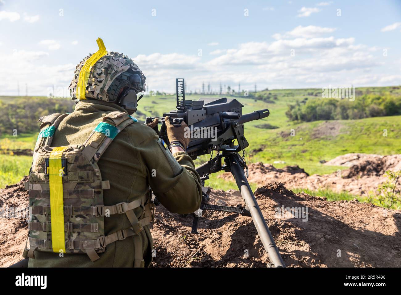 A Ukrainian Armed Forces soldier fires an automatic weapon during ...