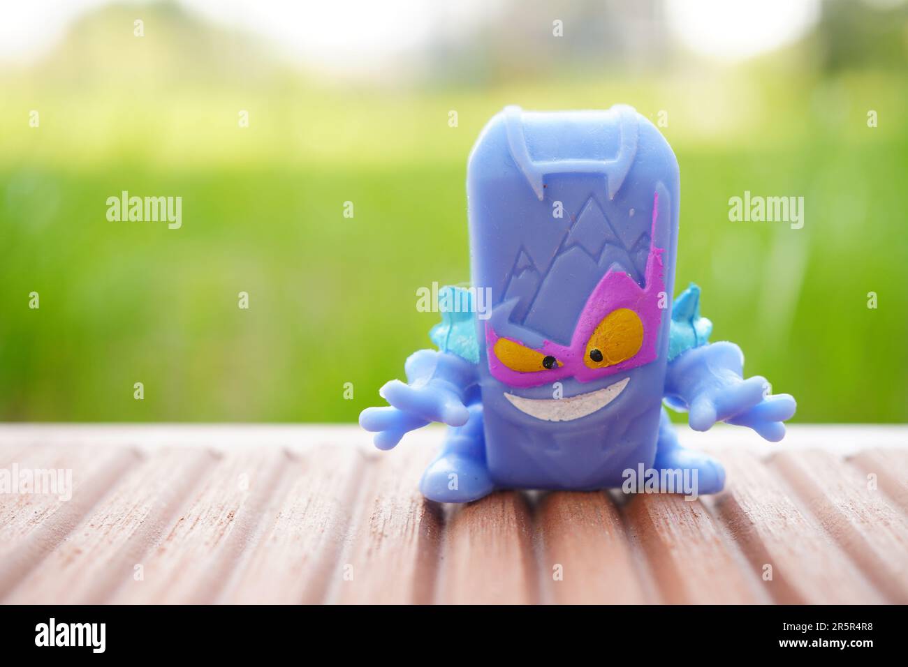 A plastic toy figurine featuring an evil-looking grin Stock Photo - Alamy
