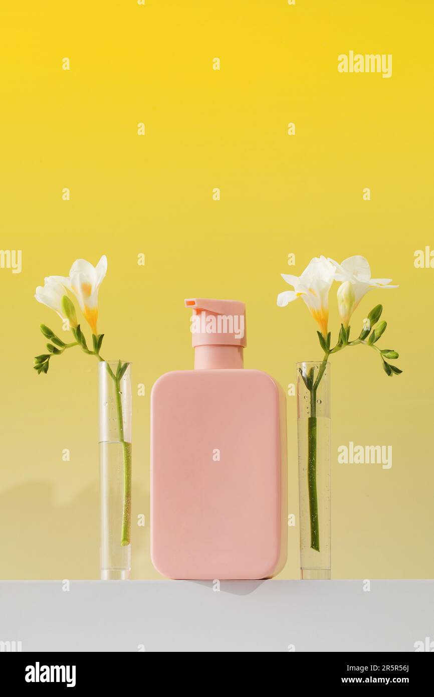 Pink dispenser with liquid cosmetic for routine care in the bathroom ...