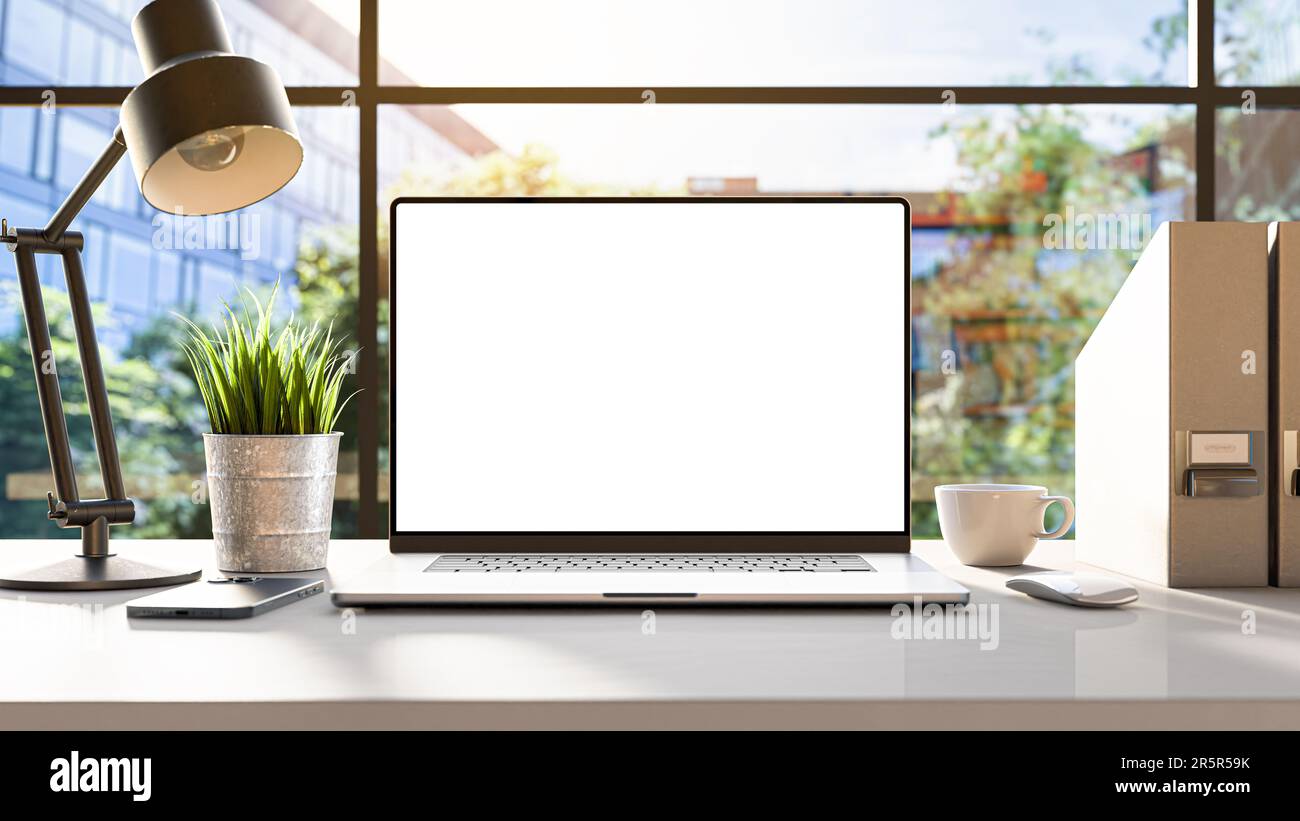 A laptop with a blank frameless screen mockup template is positioned on ...