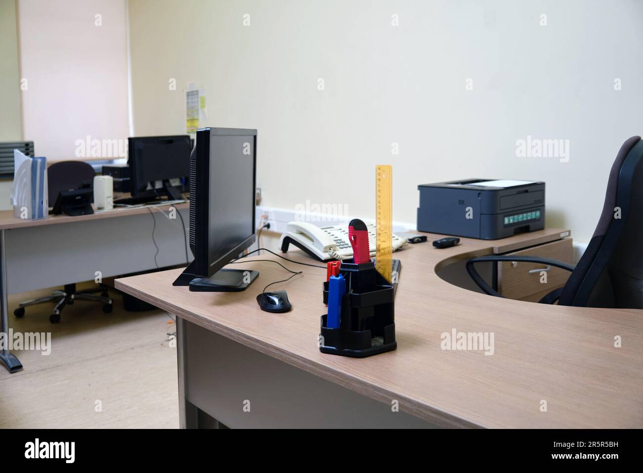 An office without people with desks with computers and a printer Stock ...