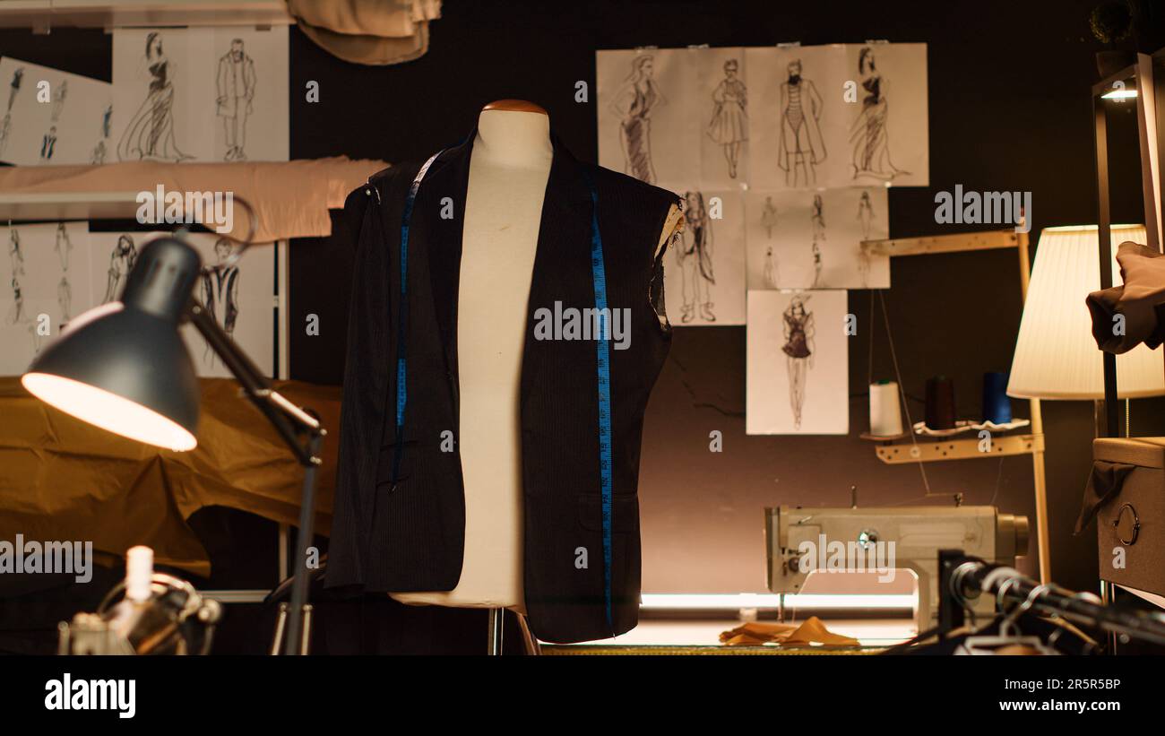 Tailoring mannequin and sketches in fashion atelier, tools used for ...