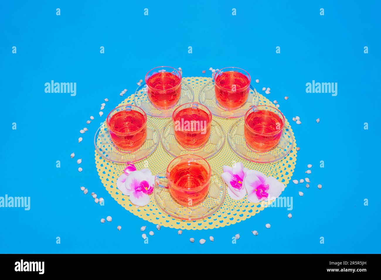 This clear glass cup allows you to appreciate the vibrant red color of ...